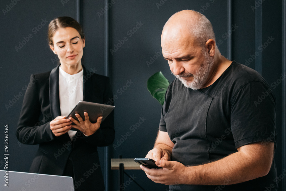 Businessman director with his assistant or secretary in a modern office ...