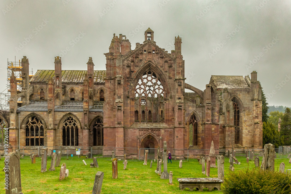 The ruins of a Gothic-style monastery in Melrose in the Scottish ...