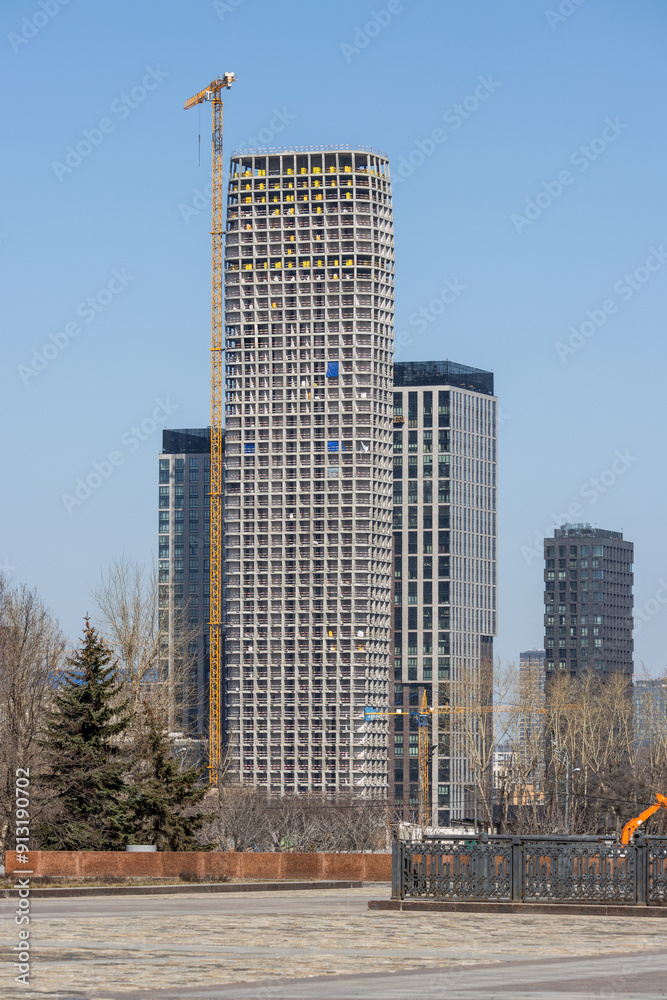 Construction of modern multi-storey buildings. Cityscape with ...