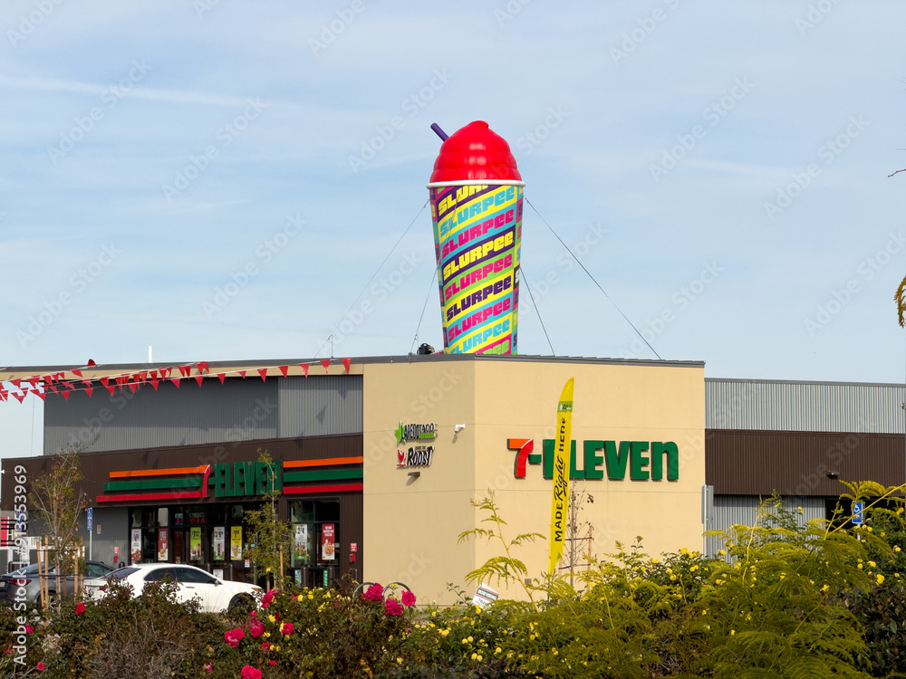 7-Eleven convenience store grand opening with large air-filled Slushee ...