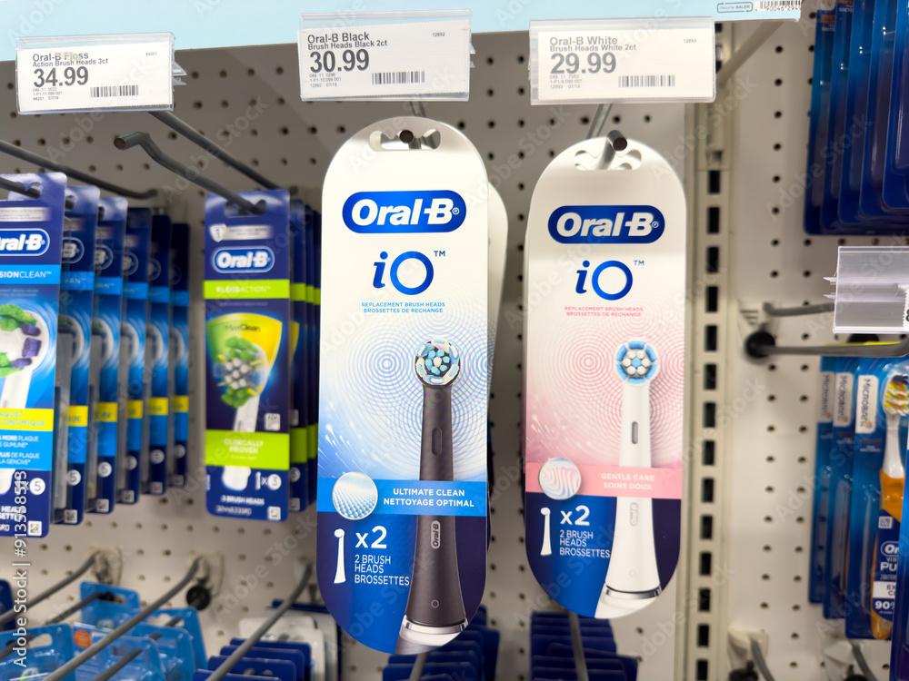 Packs of Oral-B spare iO model toothbrush heads on display in a ...