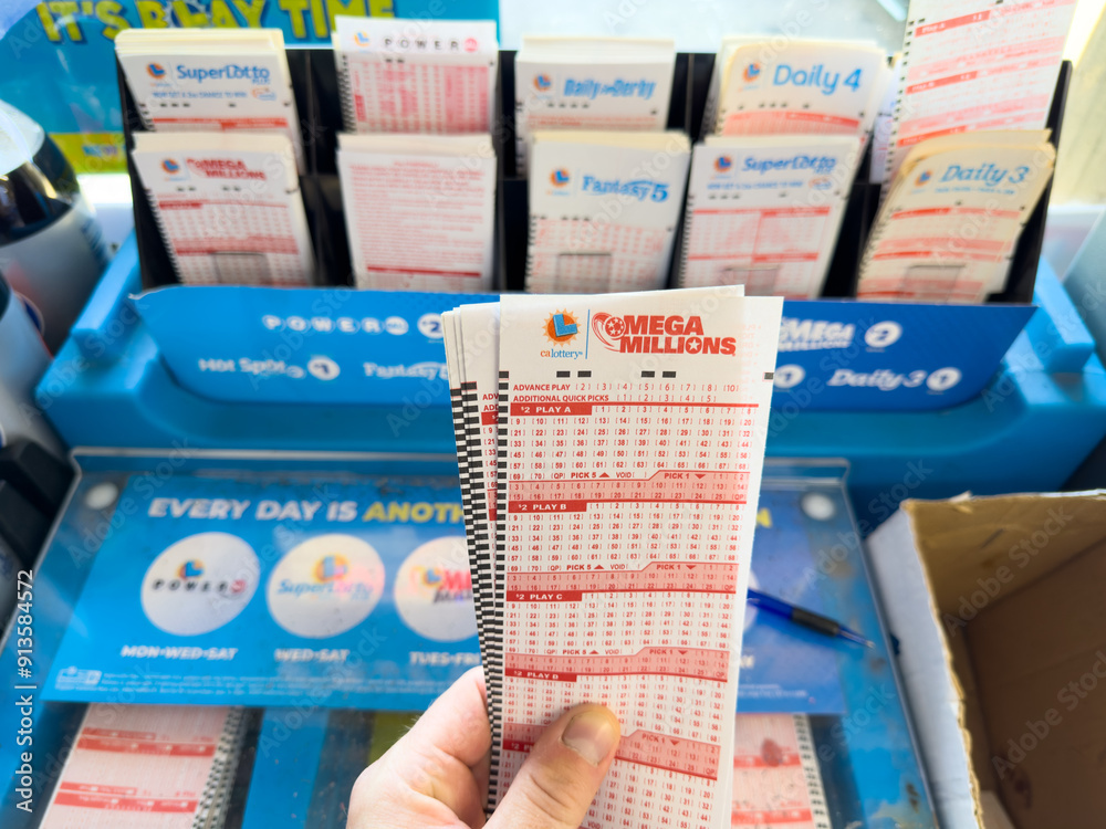 Holding a pile of Mega Millions custom number picking slips inside a ...