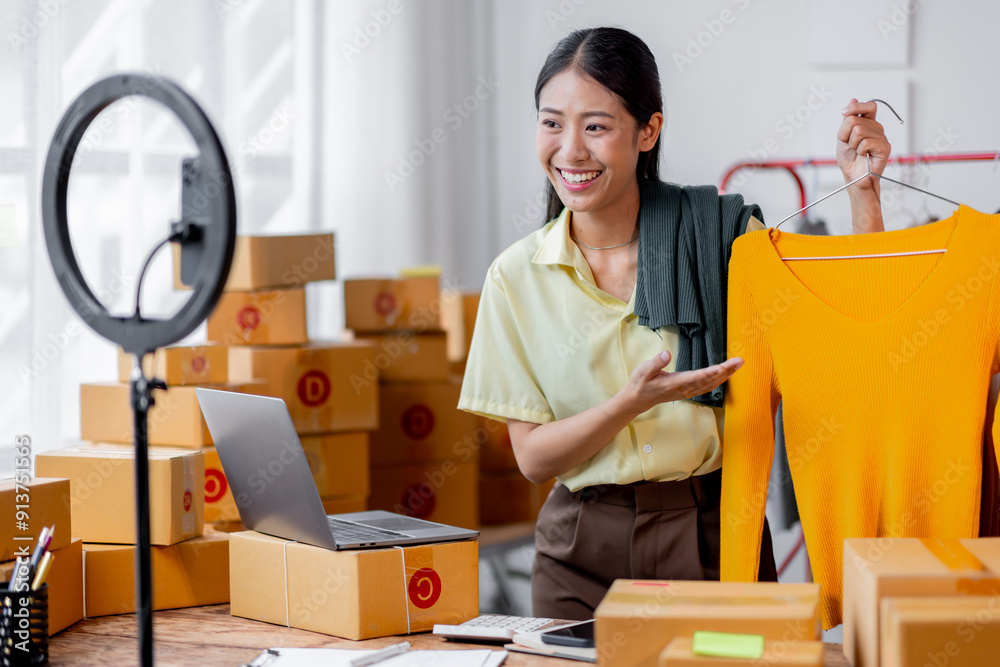 Beautiful sme woman describe selling clothes on camera live broadcast ...