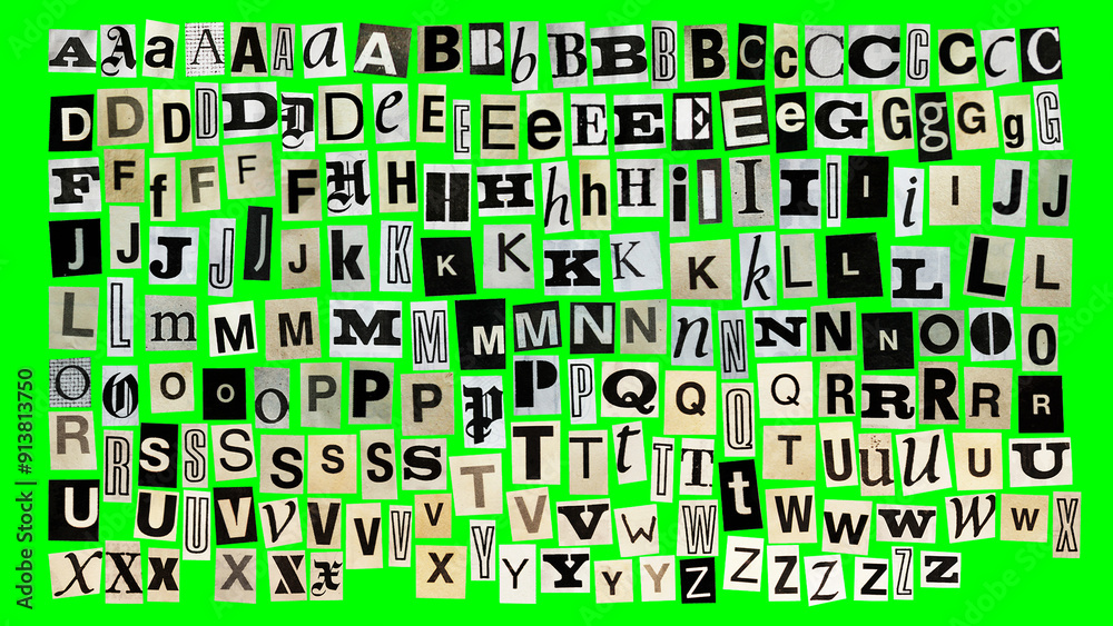 collage alphabet, letters cut out from magazine on a green background ...
