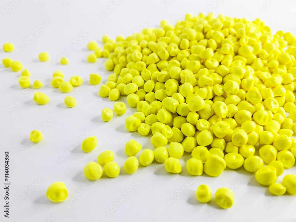 Neon yellow masterbatch granules on white background.Color pigment ...