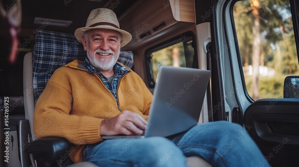 Happy older man sitting in rv camper van using laptop Smiling mature ...