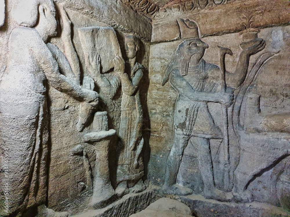 Wall relief of a priest and his assistant preparing an altar for ...