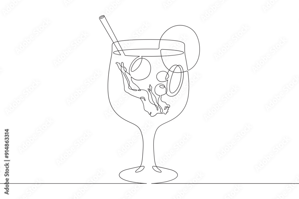 Large cocktail glass with fruit drink and straw. Girl diving in glass ...