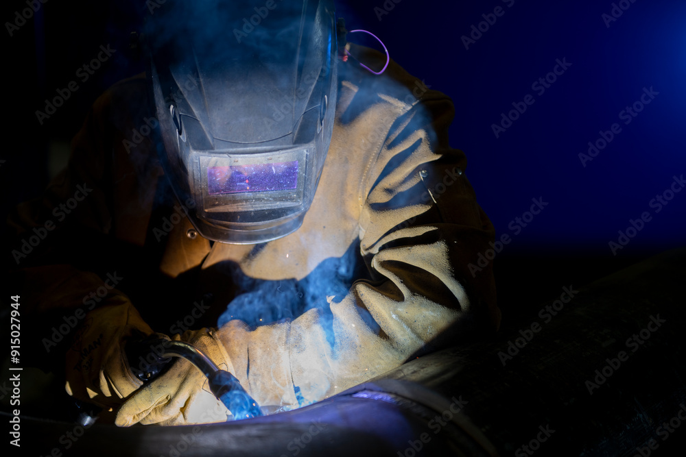 MIG welder working on pipe at the Weir service center, Tucson AZ Stock ...