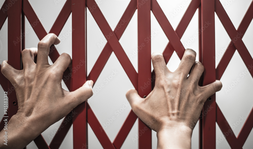 Hand gesture of a person holding the bars of a barrier Stock Photo ...