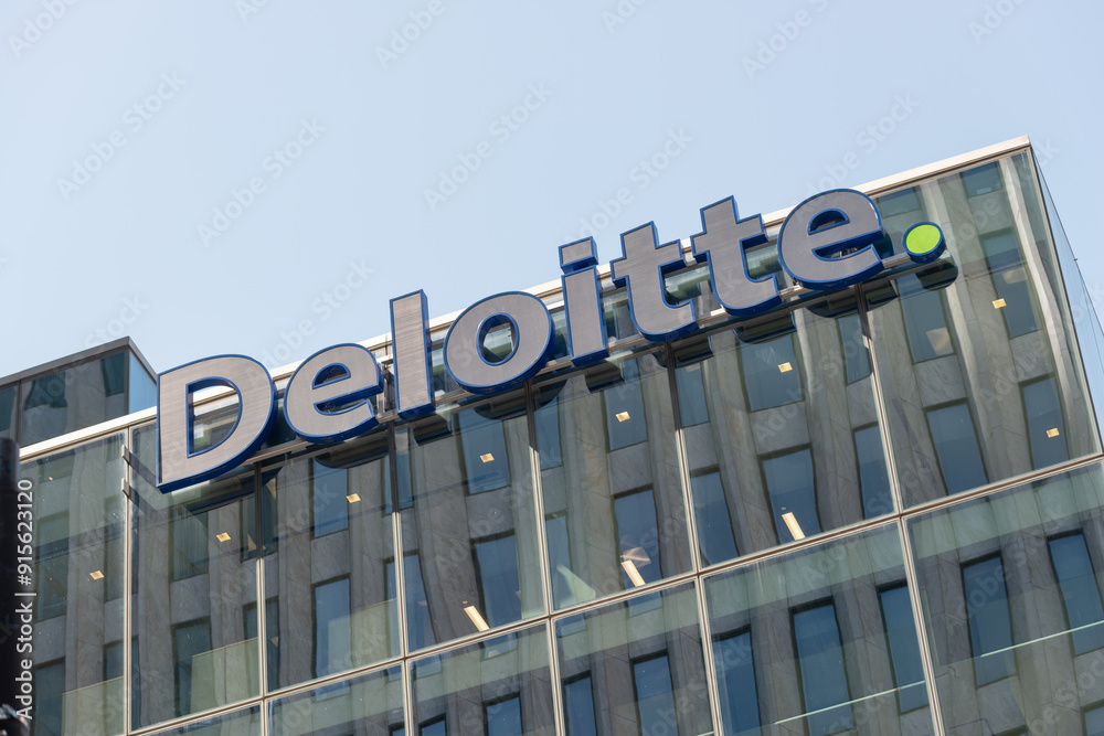 building corporate sign of Deloitte, a financial consultant, located at ...