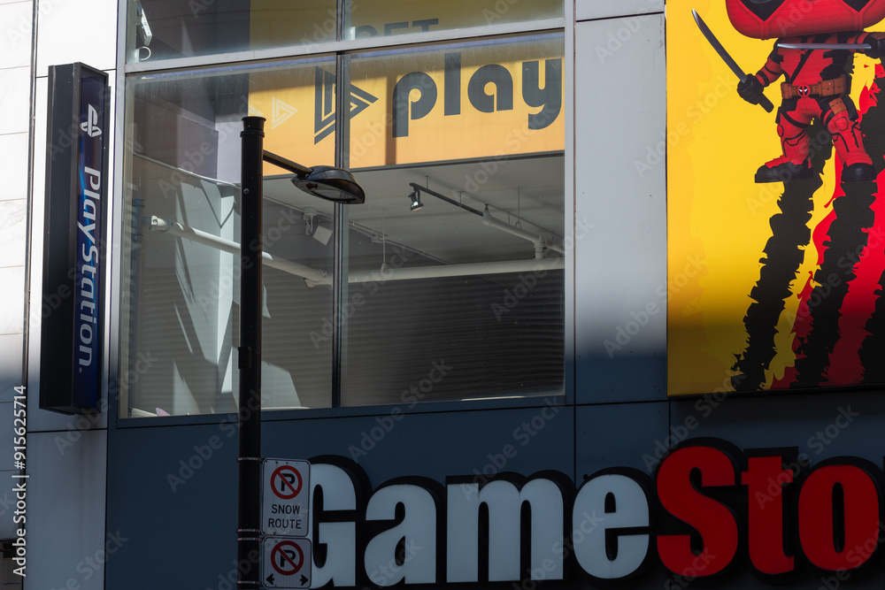 exterior building facade and signage of GameStop, a video game store ...