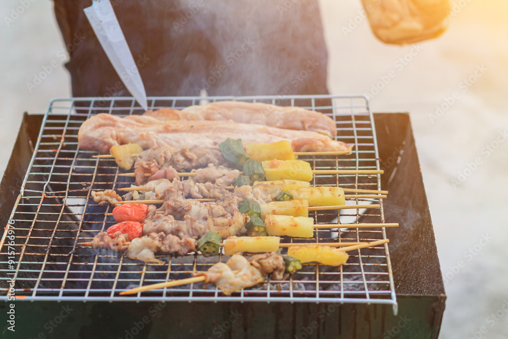 Blurred image,Barbecue (BBQ) skewered on a charcoal grill is a street ...