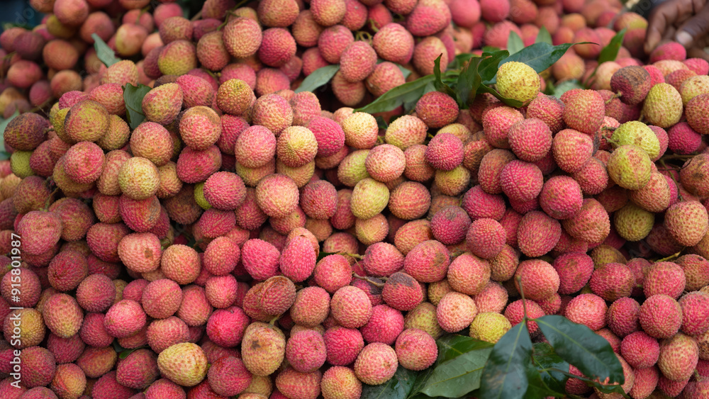 Freshly picked ripe lychees, ready for sale at the market. Vibrant ...