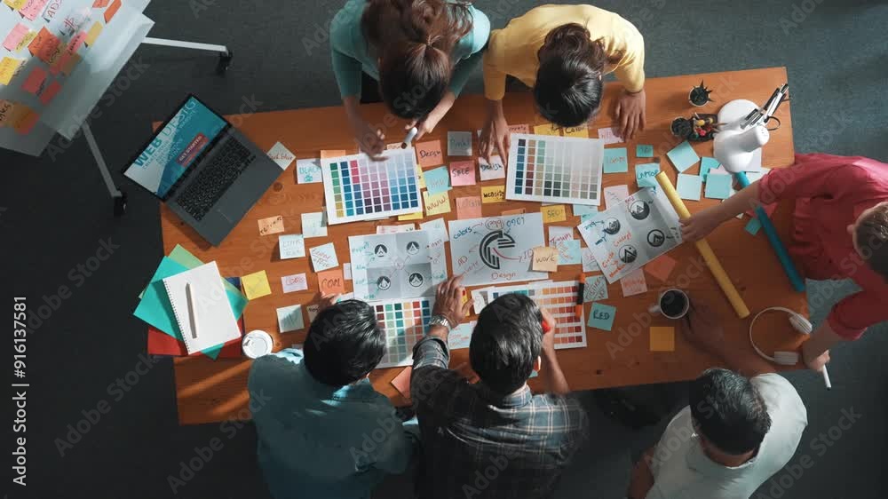 Top down view of designer compare color palettes with laptop and design ...