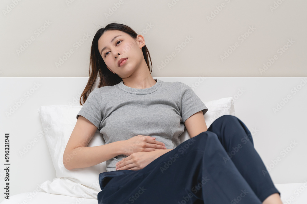 Menstruation symptom concept, Close-up woman touching her belly and ...