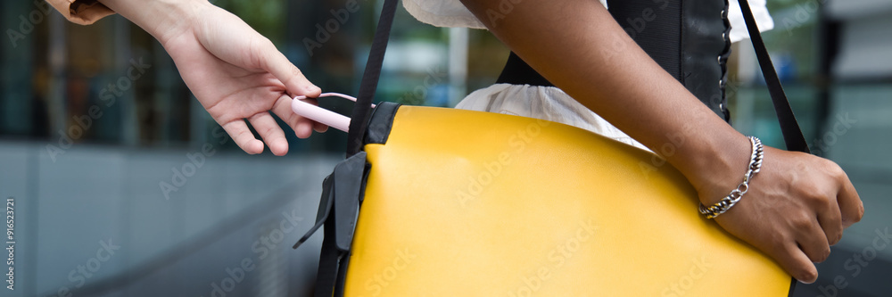 African woman about to be pickpocketed, get her smartphone stolen ...