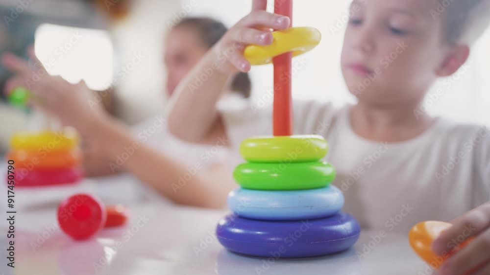 Children play in pyramid in kindergarten. learning toy development ...