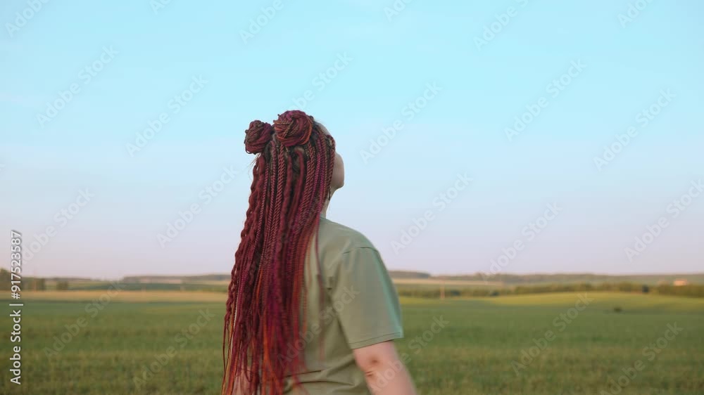 Beautiful young woman hairstyle with colorful hair extensions braid in ...