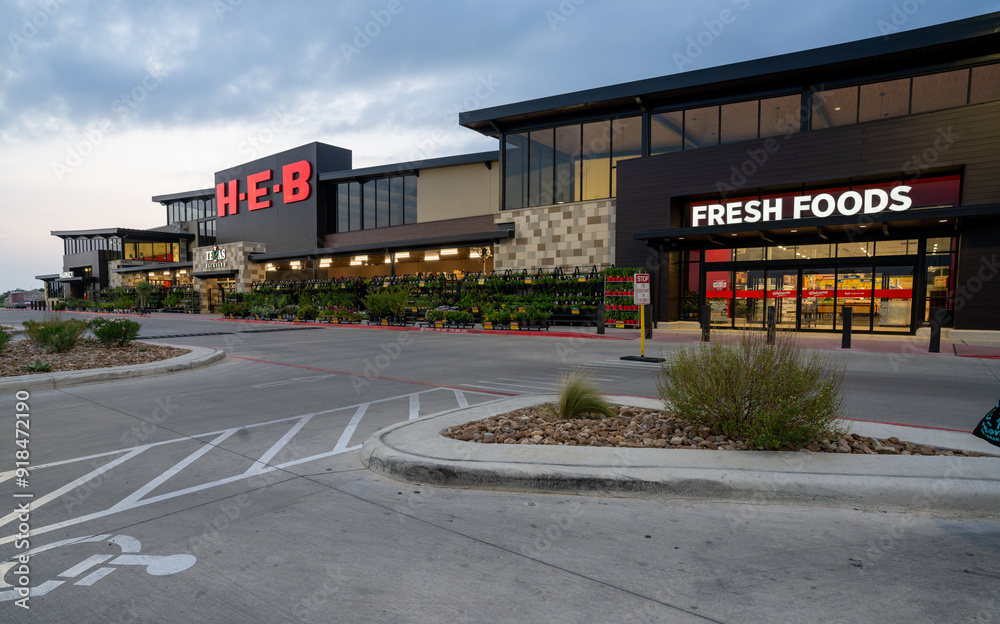 HEB fresh food and grocery store entrance with sign illuminated, Texas ...