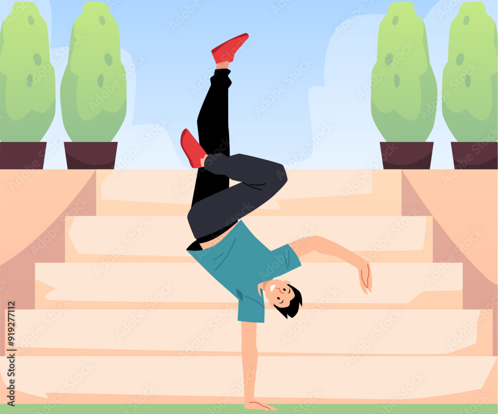 Break dancer boy showing handstands dynamic pose in park near stairs ...