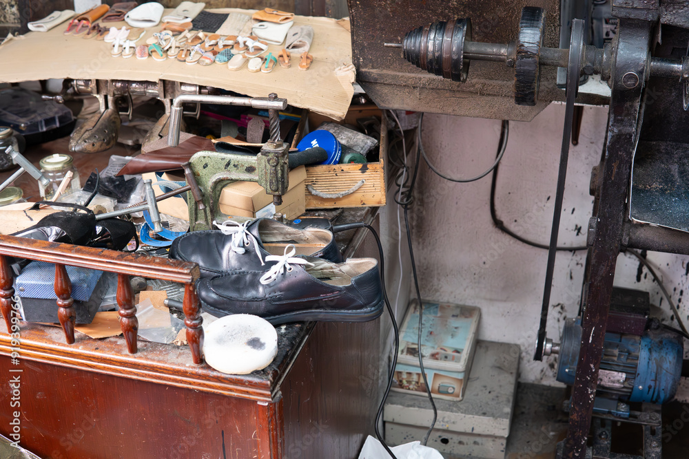 old workshop of a shoemaker, shoe polishing machinery, widening and ...