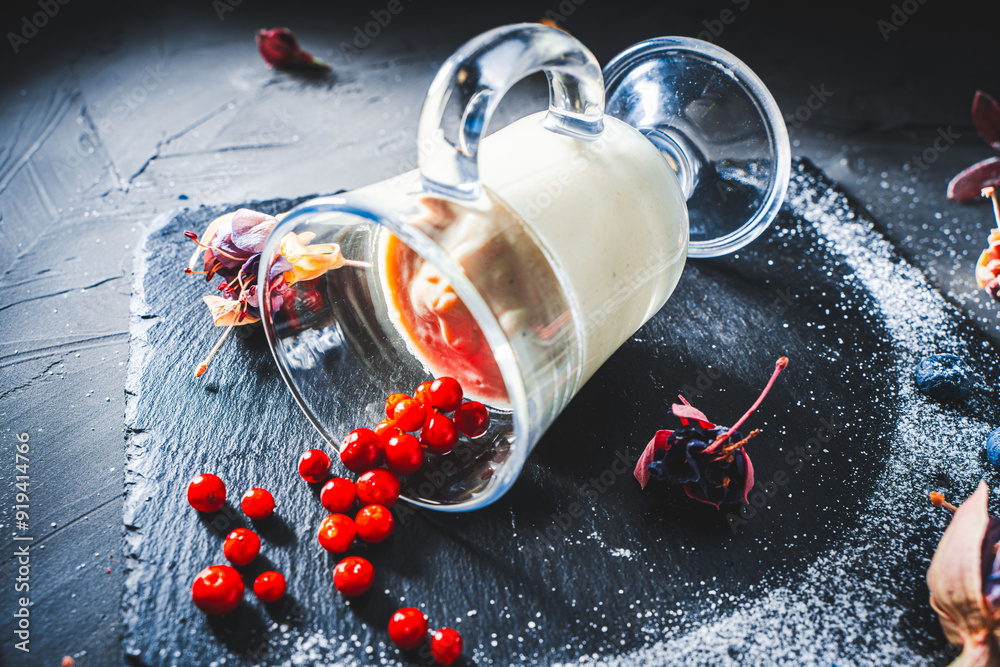 Original serving of the dessert panna cotta with lingonberries ...
