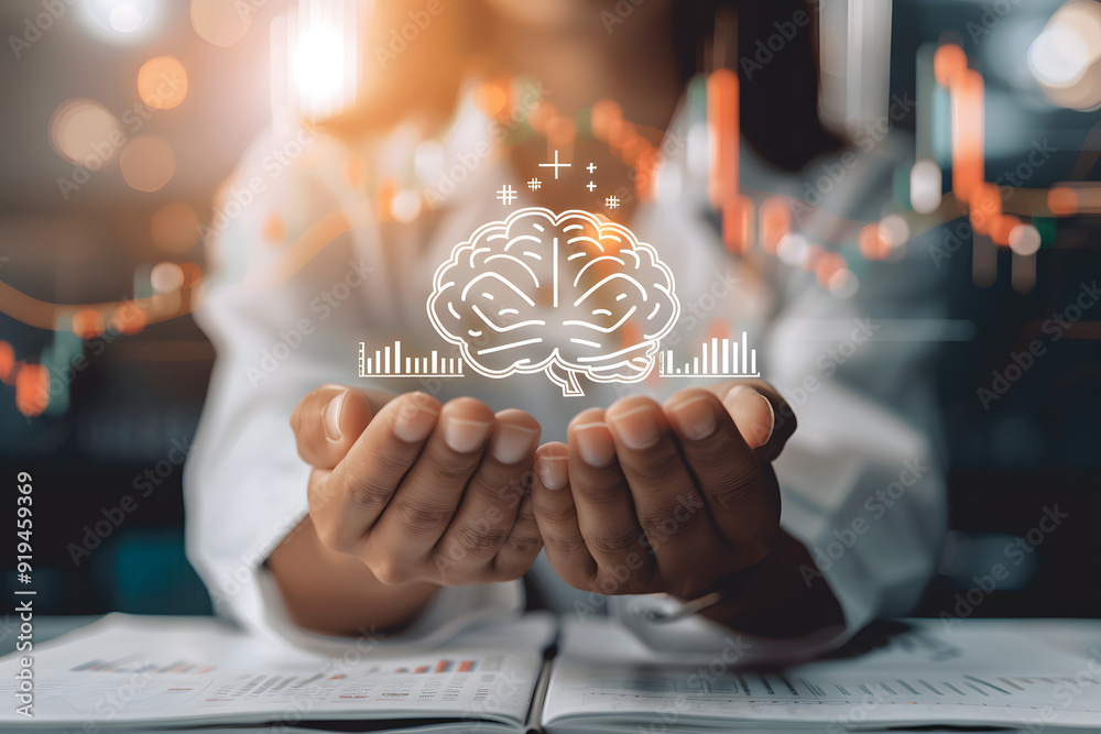 Hands holding a brain with stock market symbols, representing the ...
