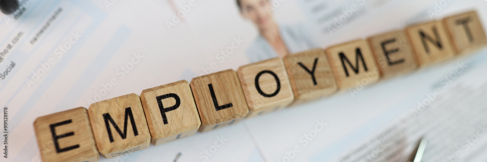 Word employment collected with wooden cubes, pen and stamp approved on ...