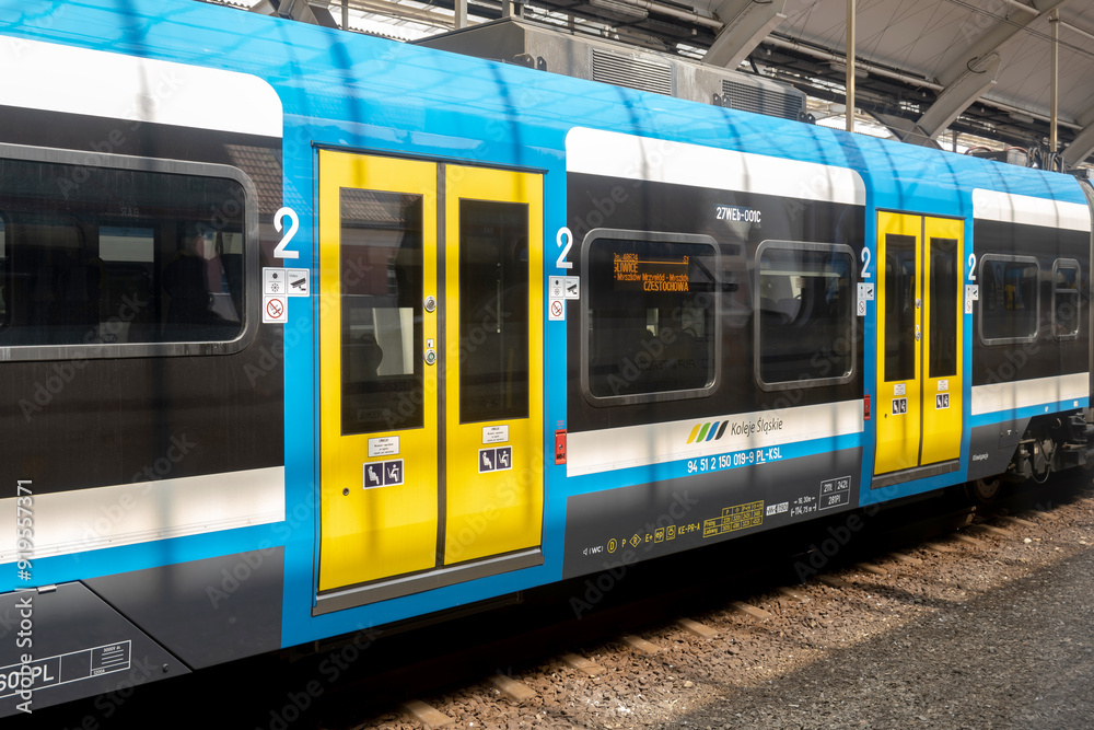 Polish Silesian Railways train waiting on the station platform, angle ...