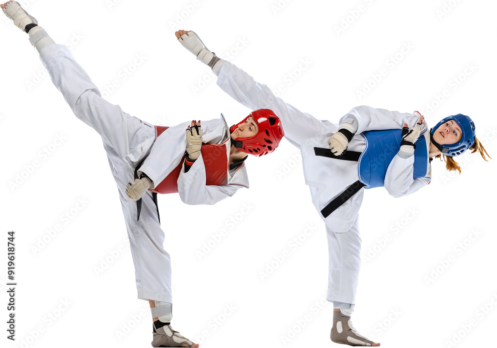 Legs kick. Dynamic portrait of two young women, taekwondo practitioners ...