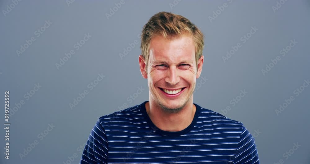 Funny, face and man in studio laughing with happiness, freedom or ...