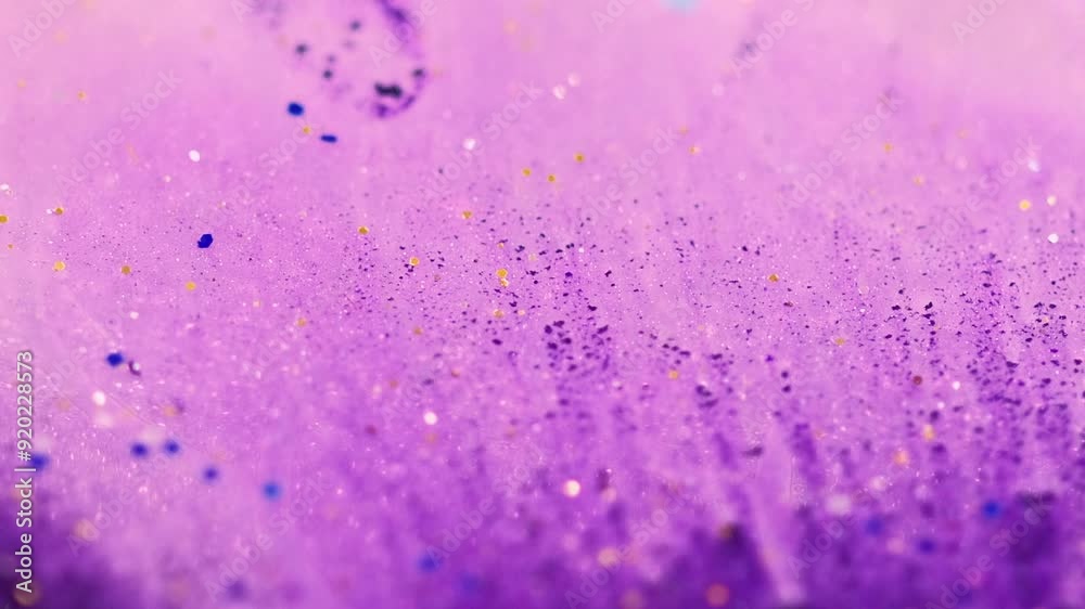 Shimmering paint. Liquid glitter flow. Defocused purple color shiny ...