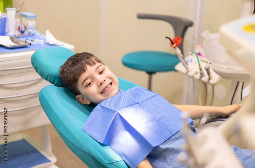 kid in dental office. dentist checking child teeth using tools mouth ...