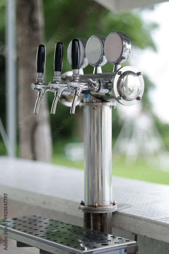 Beer dispenser is installed on the bar counter. Beer dispenser with ...