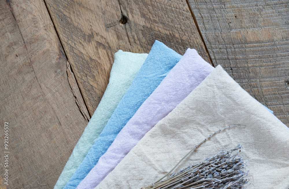 Stack of complementary pastel colors of cotton fabric and bundle of ...