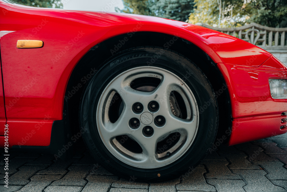 Photo of a red Nissan 300ZX Twin Turbo. They show details of the car ...