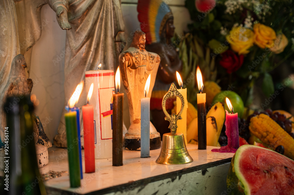 candles, fruits, flowers on an Umbanda altar, a Brazilian religion of ...