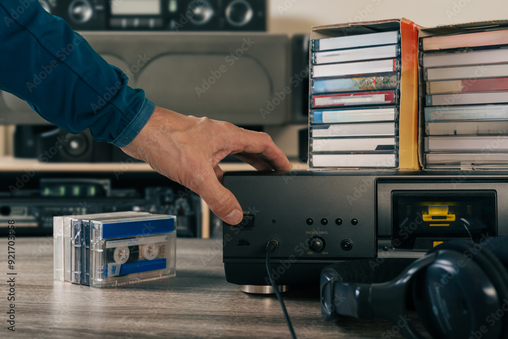 Male hand pressing on 'Play' button on retro tape recorder. Retro audio ...
