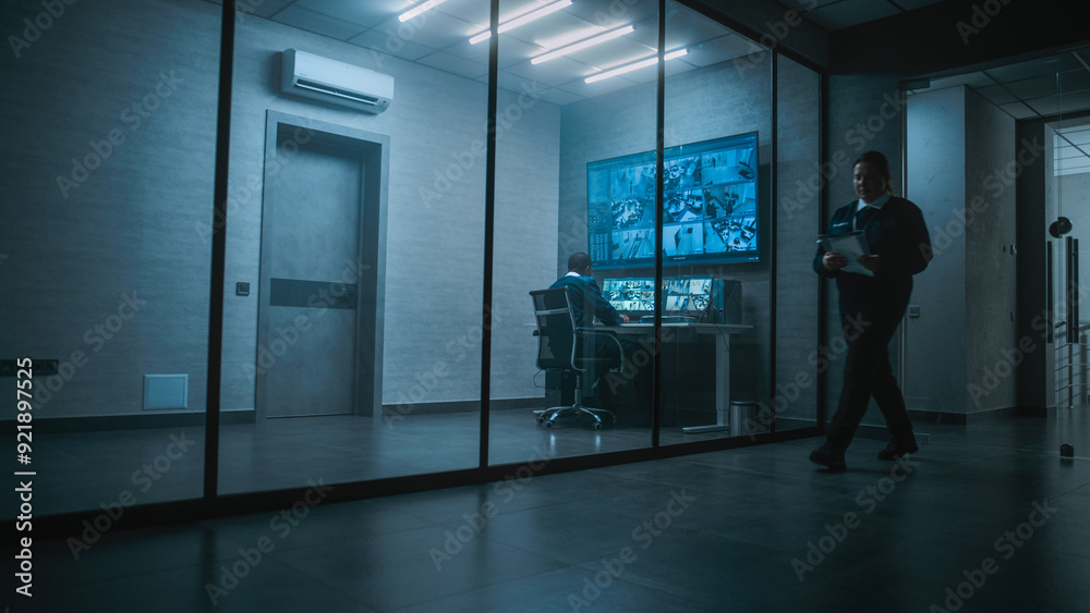 Female security worker have discussion with colleague in monitoring ...
