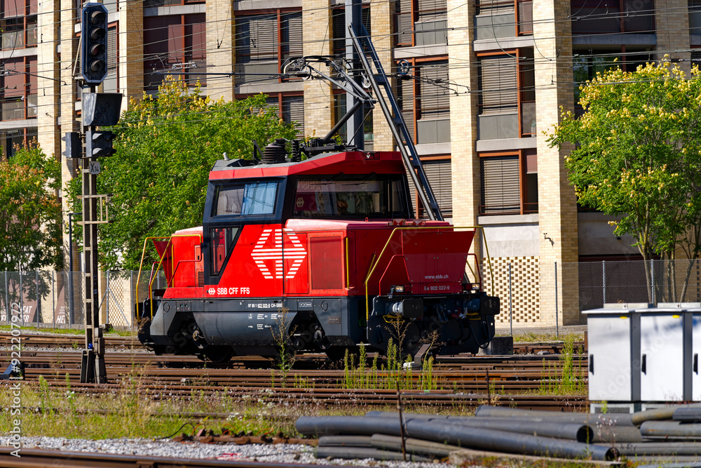 Red electric shunting locomotive of Swiss railway company SBB CFF FFS ...