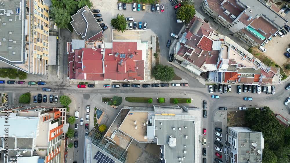 Top-down view of a city block with residential buildings, green spaces ...
