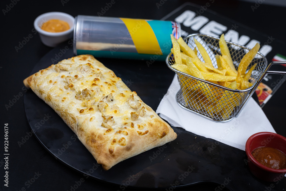 French-Moroccan tacos with french fries with ketchup and a soft drink ...