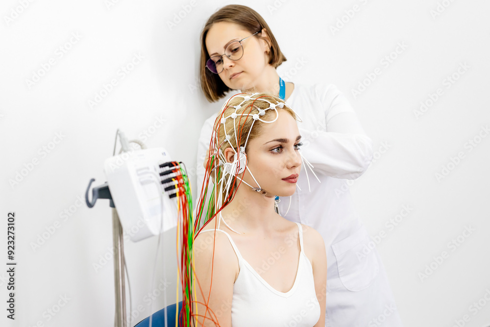 Female patient undergoing an EEG test, showcasing modern healthcare and ...