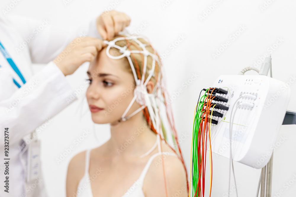Female patient undergoing an EEG test, showcasing modern healthcare and ...