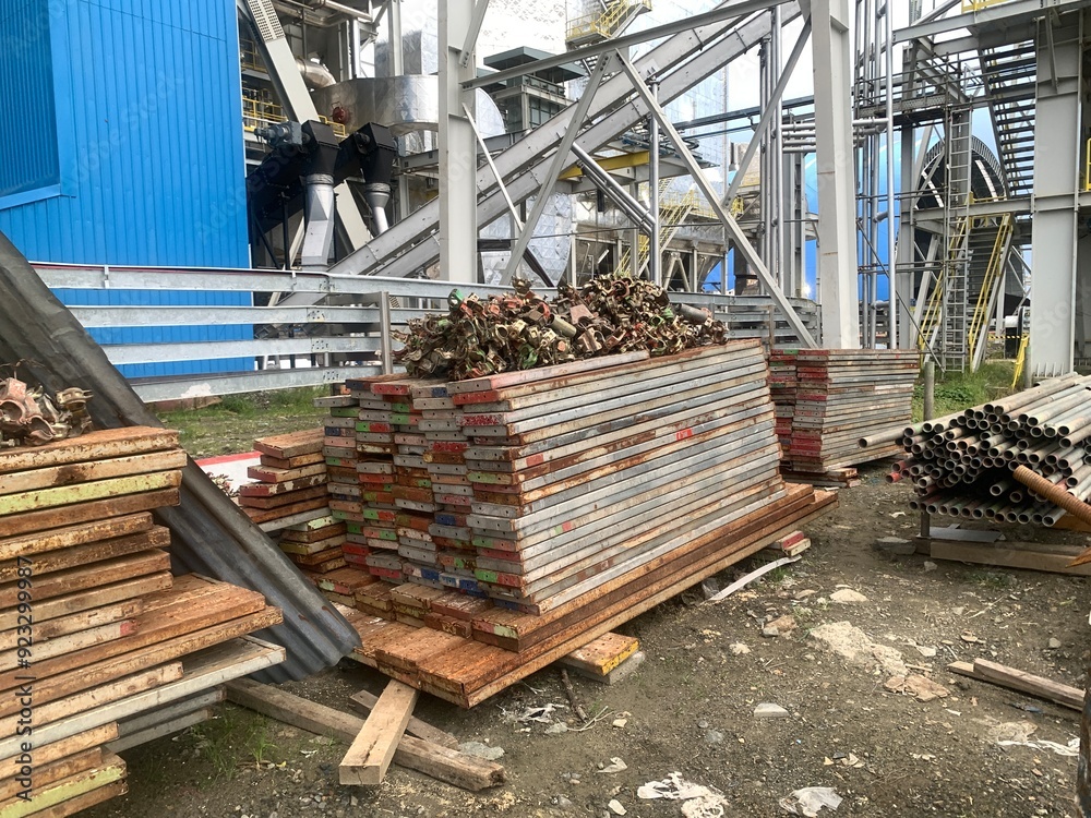 Lot of Asiba scaffolding and double clamp lay on the site power plant ...