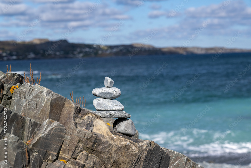 Inukshuk is a stack of granite rocks in the form of a person. The ...