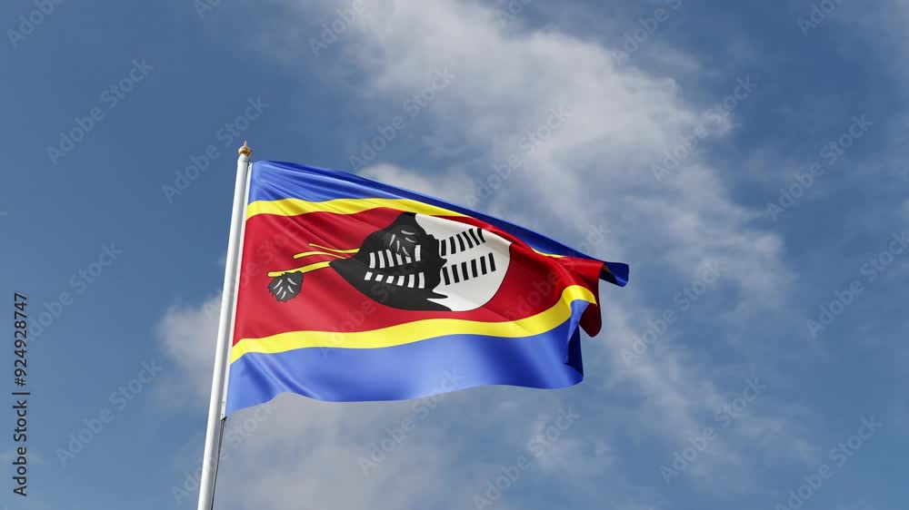 Flag of eswatini on a blue sky, flag on a flag pole waving in the wind ...