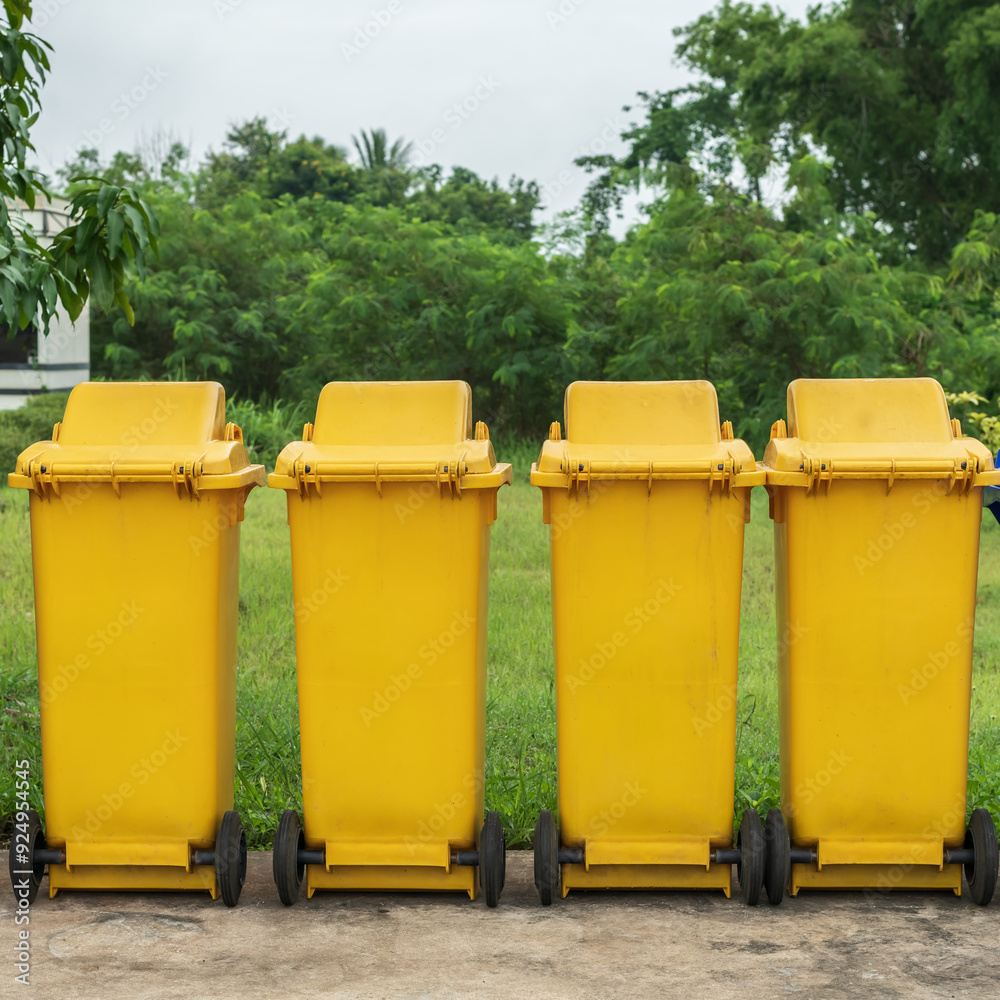 Colorful trash cans for sorting garbage. For plastic, glass, paper and ...