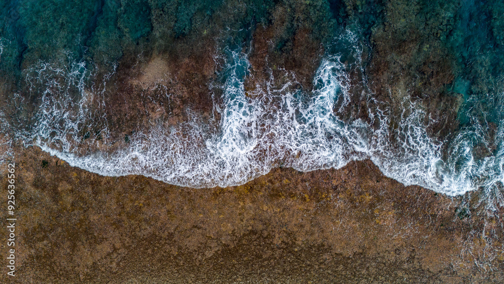 Drone view above ocean waves near the islands of Taha'a and Bora Bora ...